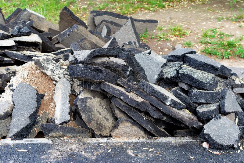 Pieces of Asphalt on the Side of the Road.Reconstruction of the Coating ...