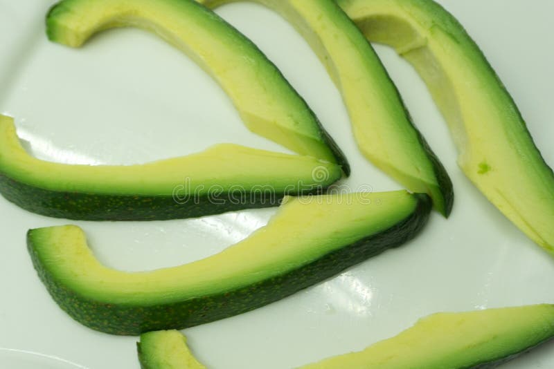 Pieces of Avocado and Avocado on a Dressing Stock Image - Image of ...