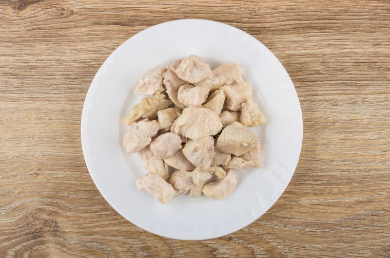 Pieces of Boiled Chicken Meat in White Plate on Table Stock Photo ...