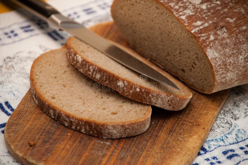 Pieces of Bread on Breadboard Stock Photo - Image of food, nutrition ...