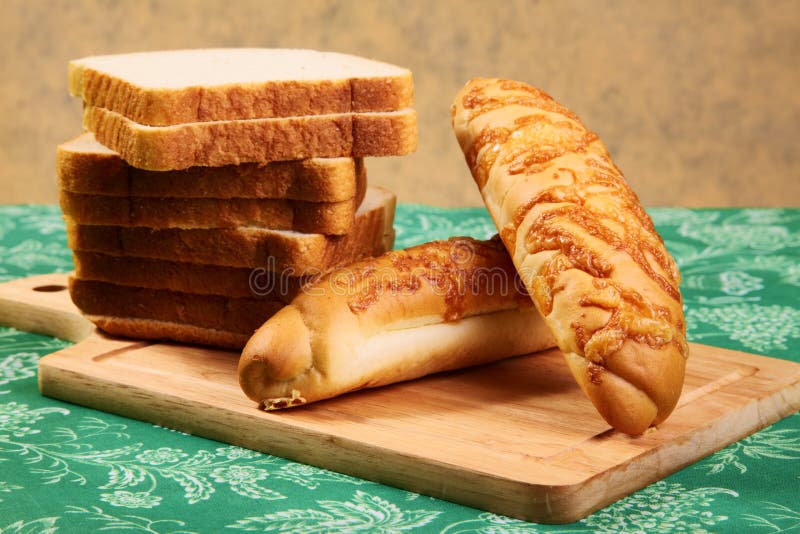 Pieces of Bread and Roll on a Kitchen Table Stock Photo - Image of ...