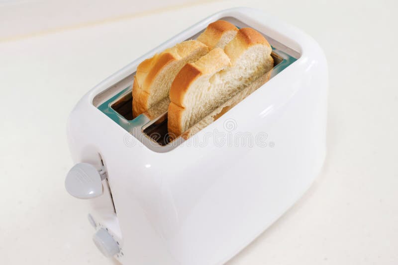 Pieces of Bread in a Toaster on White Background, Side View. Stock ...