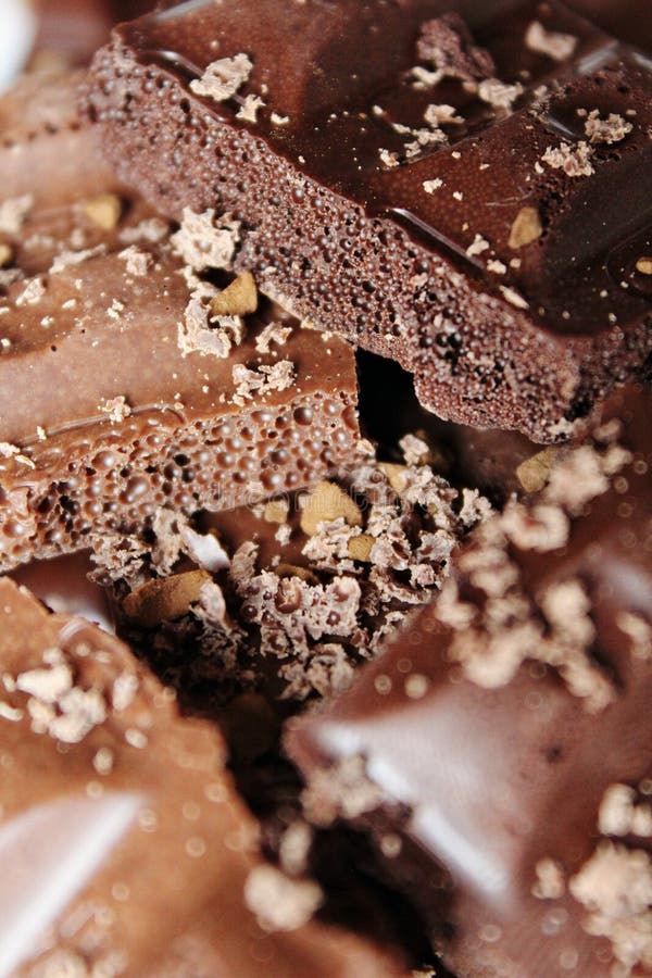 Pieces of Broken Brow Chocolate Sprinkled with Grated Chocolate Closeup ...
