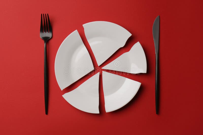 Pieces of Broken Ceramic Plate and Cutlery on Red Background, Flat Lay ...