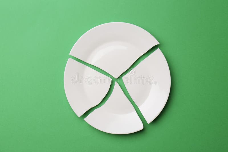 Pieces of Broken Ceramic Plate on Green Background, Flat Lay Stock ...
