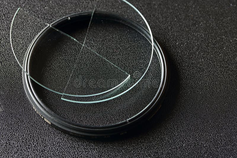 PIECES of BROKEN CIRCULAR GLASS of a LENS FILTER Stock Photo - Image of ...