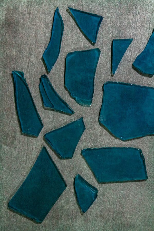 Pieces of Broken Glass on a Gray Background. Collage. Stock Image ...