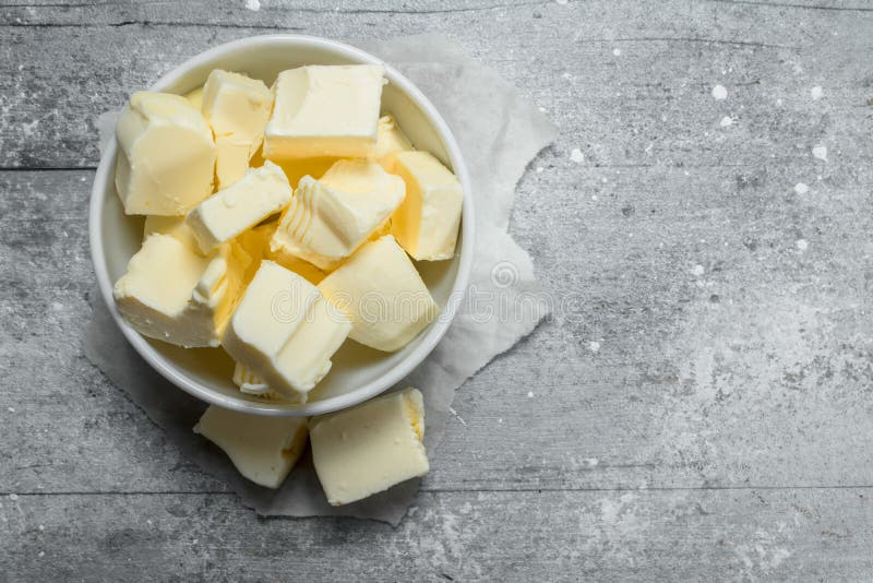 Pieces of Butter in the Bowl Stock Photo - Image of butterfat, cutout ...