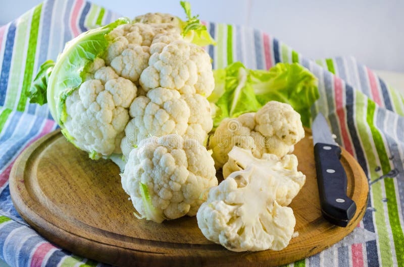 Cauliflower Pieces On A Rustic Table Stock Image - Image of part ...
