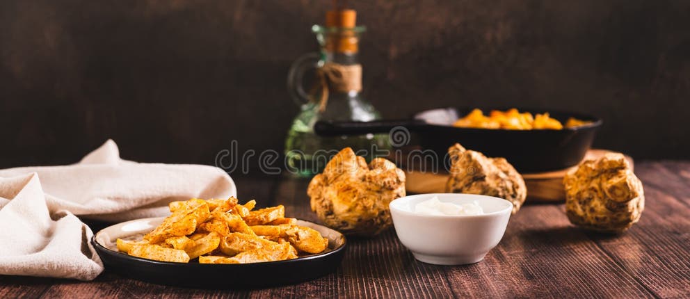 Pieces of Celery Root Fried with Paprika on a Plate on the Table Web ...