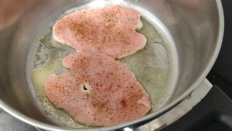 Pieces of Chicken Breast are Fried in a Pan on an Induction Oven Stock ...