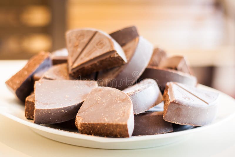 Pieces of Chocolate on a Dish Stock Photo - Image of brown, space: 47783276