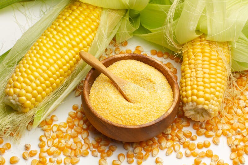 Pieces of Corn and Cornmeal in a Wooden Bowl on a White Background ...