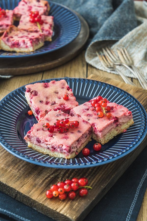 Pieces of Creamy Red Currant Pie on a Blue Plate on Wooden Background ...