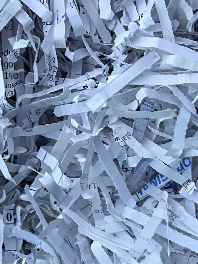 Pieces of Cut Paper Documents Pulled Out of Shredder As Background ...
