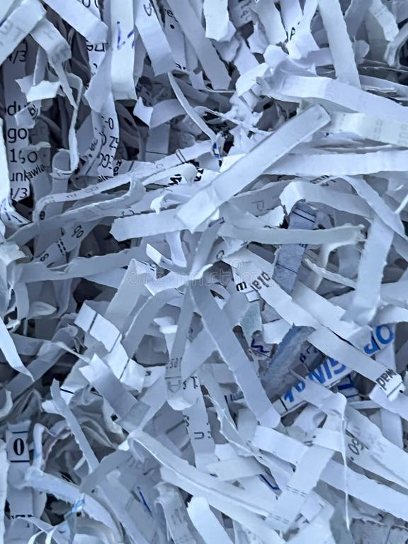 Pieces of Cut Paper Documents Pulled Out of Shredder As Background ...