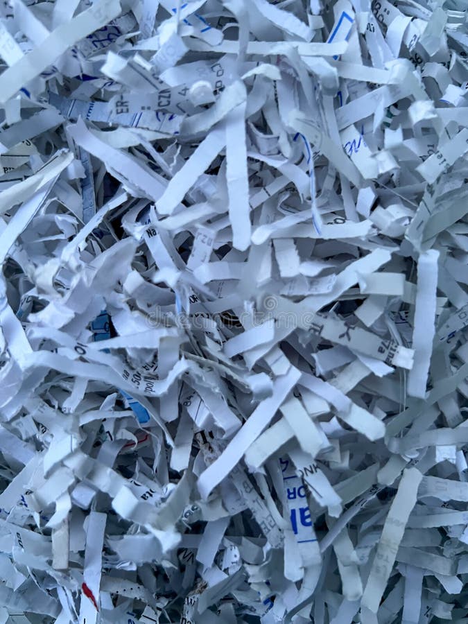 Pieces of Cut Paper Documents Pulled Out of Shredder As Background ...