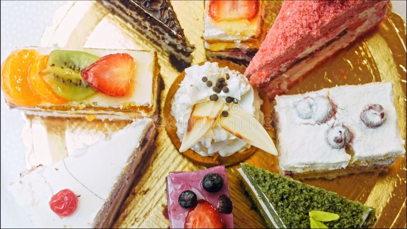 Pieces of Different Cakes on a Gold Platter. Slider and Macro Shooting ...