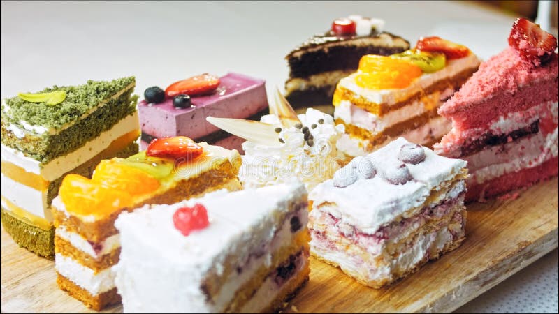 Pieces of Different Cakes on a Retro-style Baking Tray. Slider and ...