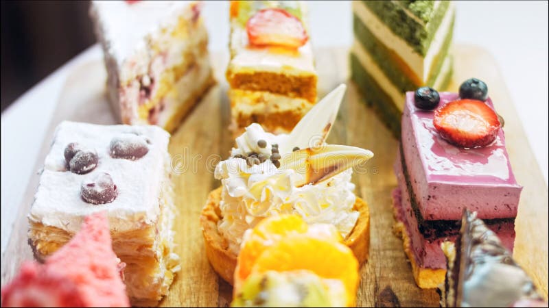 Pieces of Different Cakes on a Retro-style Baking Tray. Slider and ...