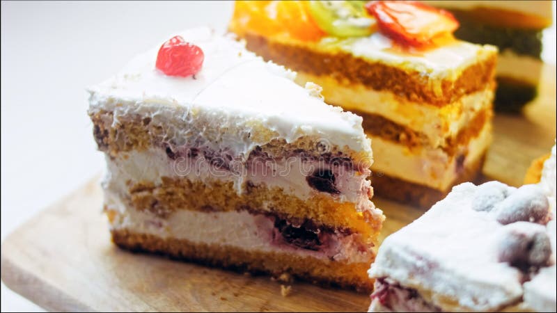 Pieces of Different Cakes on a Retro-style Baking Tray. Slider and ...