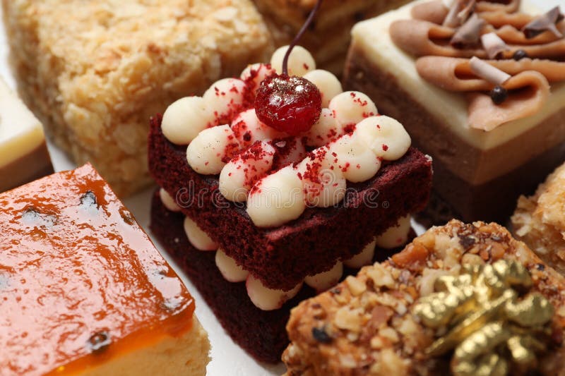 Pieces of Different Delicious Cakes on Table, Closeup Stock Image ...