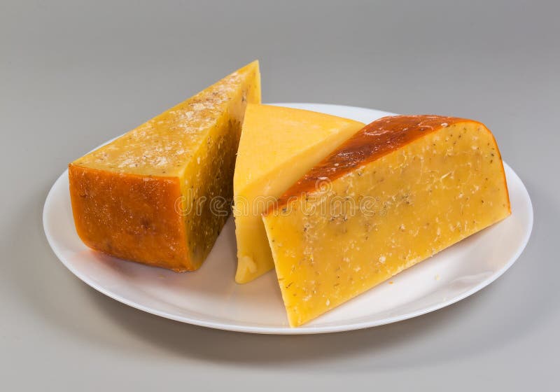 Pieces of Different Hard Cheese on Dish on Gray Background Stock Image ...