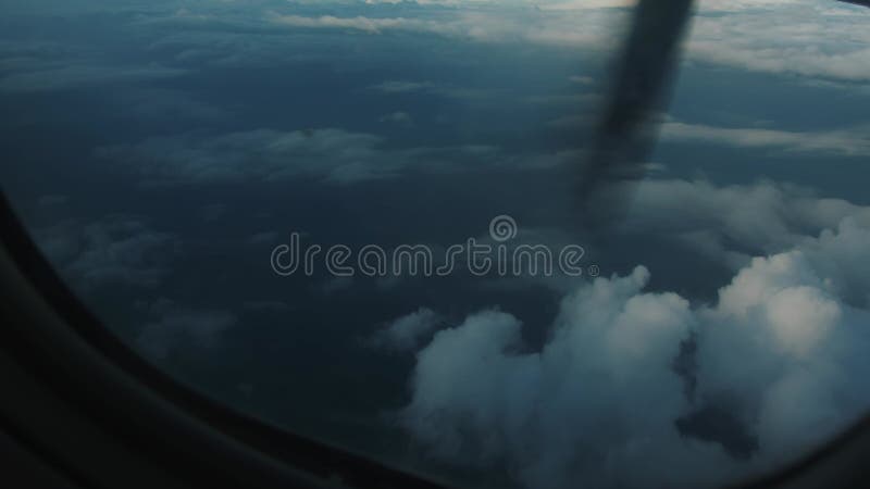 View from Window of Rotating Propeller of an Airplane Flying Above ...