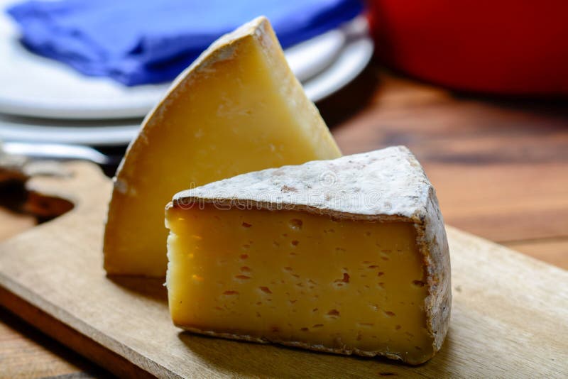 Pieces of French Tomme and Cantal Cheese, Close Up Stock Image - Image ...