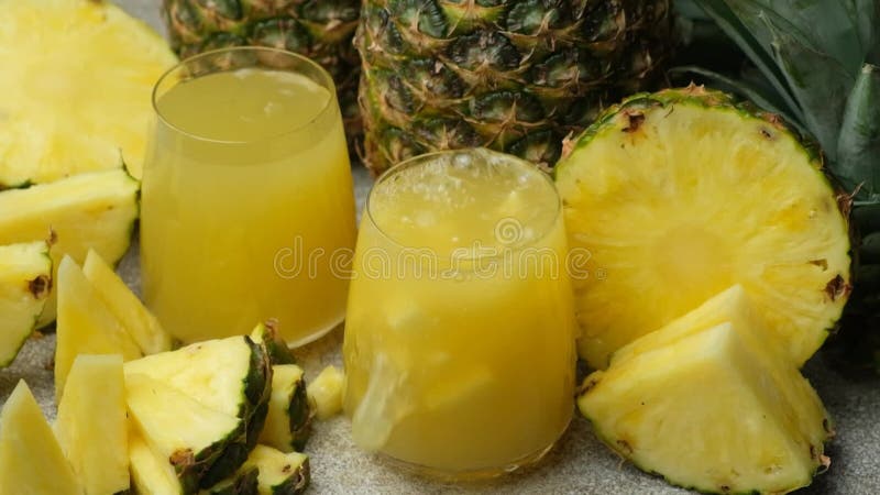 Pieces of Fresh Pineapple Fall into Pineapple Juice, Juice Splash Slow ...
