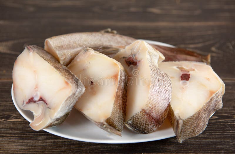 Pieces of Fresh Raw Fish Cod on a Wooden Background Stock Image - Image ...
