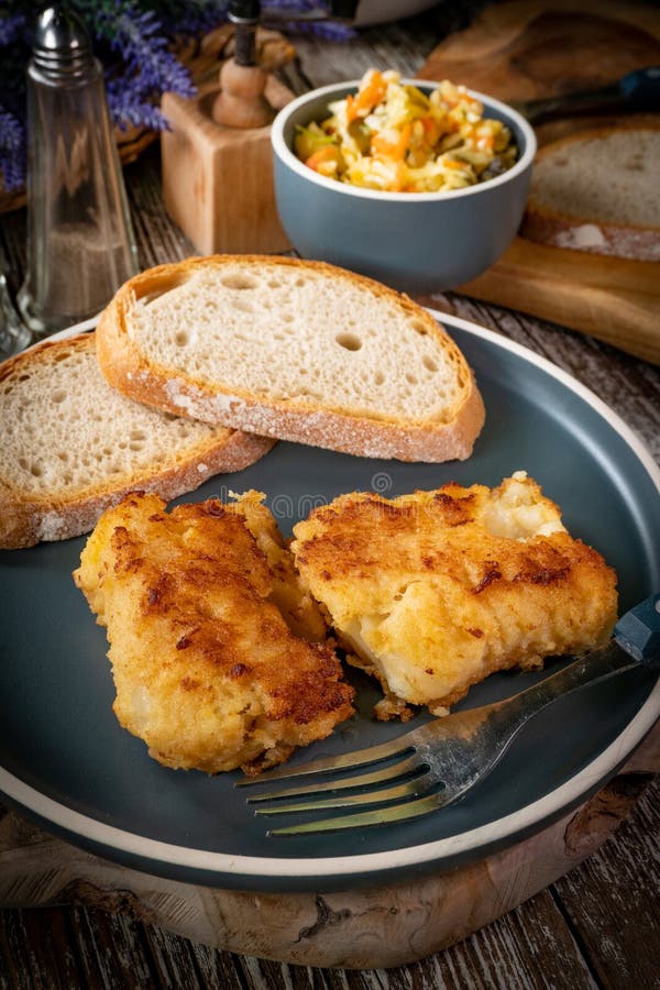 Pieces of fried cod fillet stock photo. Image of meal - 287046072