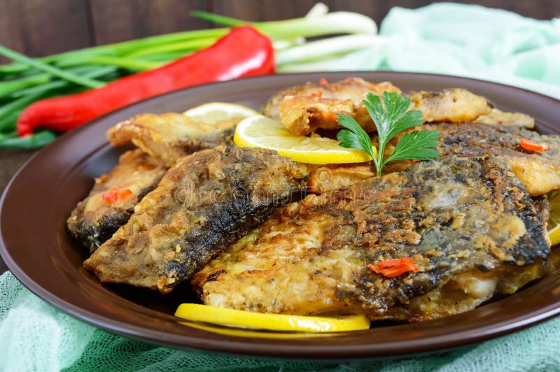 Pieces of Fried Fish Carp on a Ceramic Plate Stock Photo - Image of ...