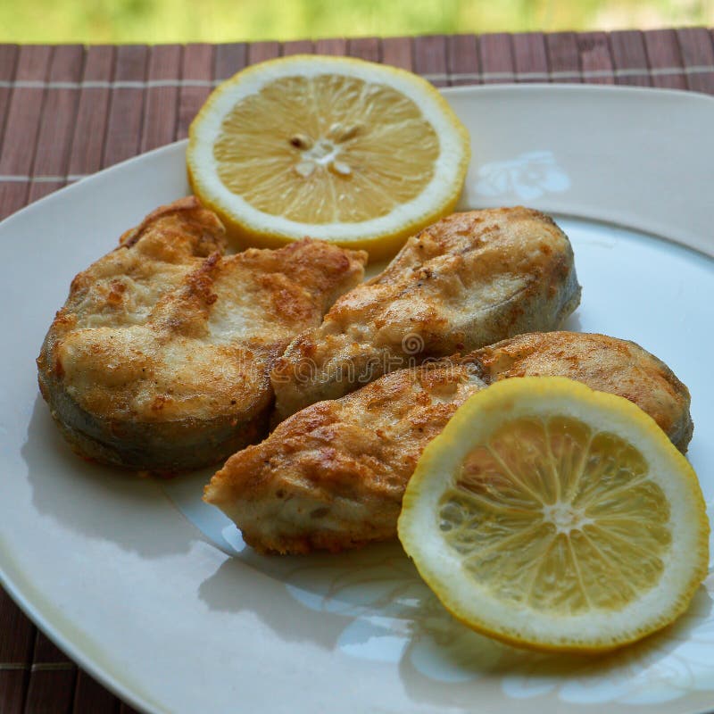 Pieces of Fried Fish with Lemon Wedges. Stock Photo - Image of supper ...