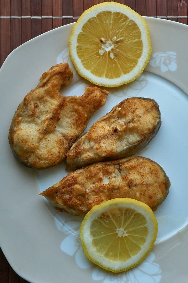 Pieces of Fried Fish with Lemon Wedges. Stock Image - Image of fresh ...