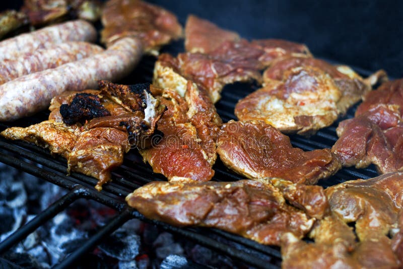 Pieces of Fried Meat on a Grate, with Smoke and Fire. Fried Meat on ...