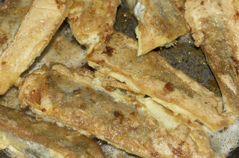 Pieces of Fried Whiting in Batter in a Frying Pan Stock Photo - Image ...