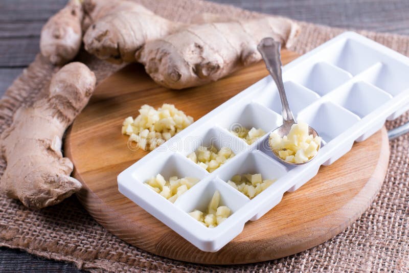 Pieces of Ginger in a Container for Freezing Ice Cubes Stock Photo ...