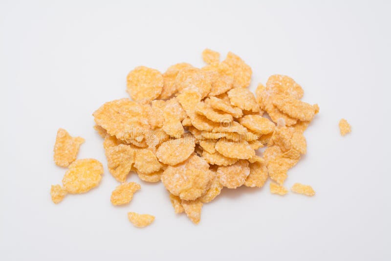 Pieces of Golden Corn Flakes on White Stock Photo - Image of drop ...