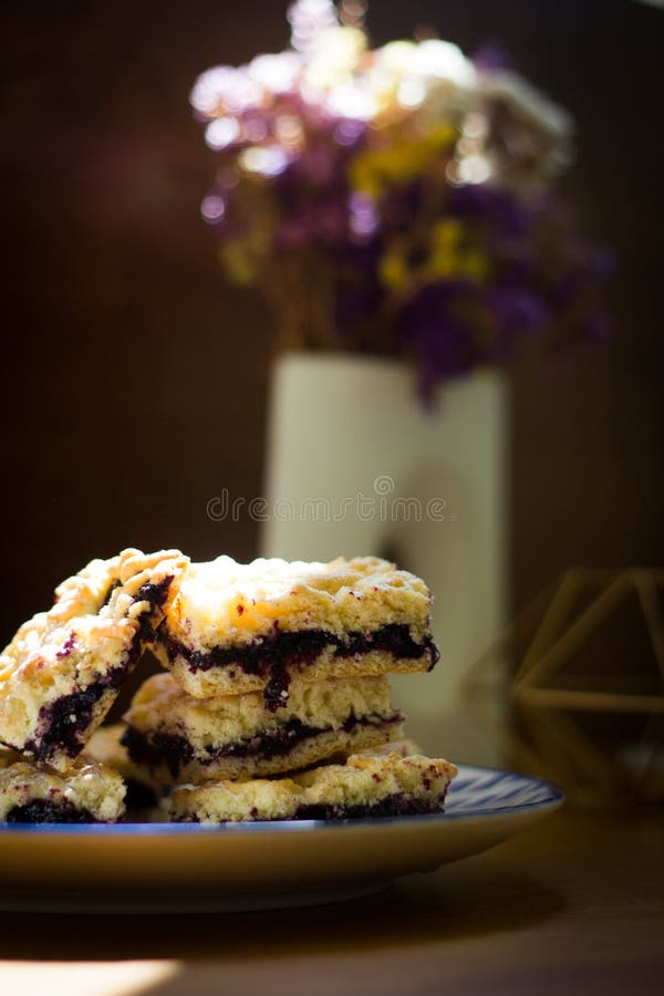 Pieces of Grated Cake with Blueberry Jam on Plate Stock Photo - Image ...