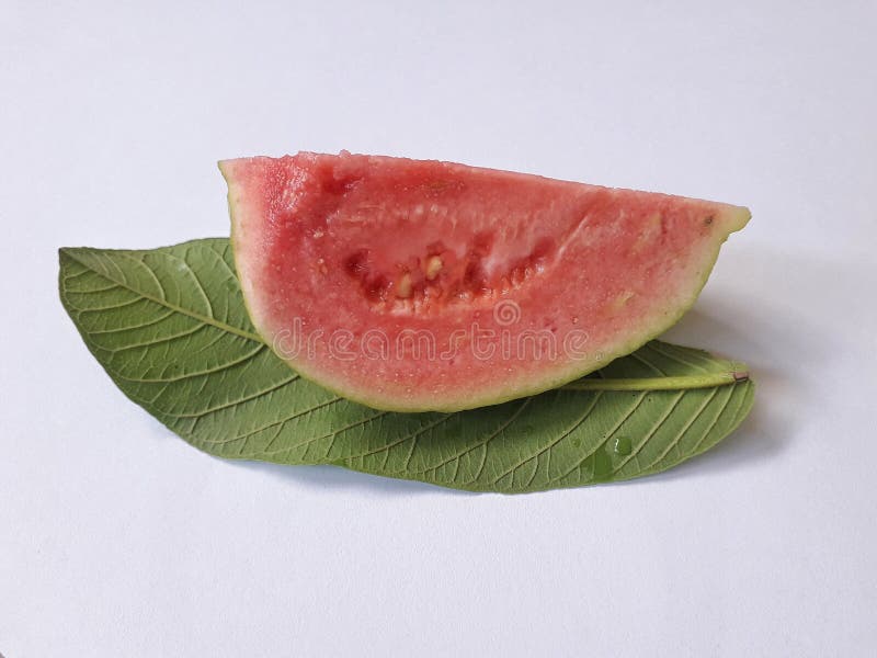 Pieces of Guava Fruit on the Leaves with a White Background Stock Photo ...