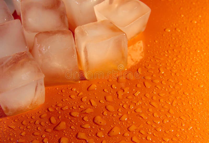 Pieces of Ice on a Bright Background with Water Drops. Orange Fresh ...