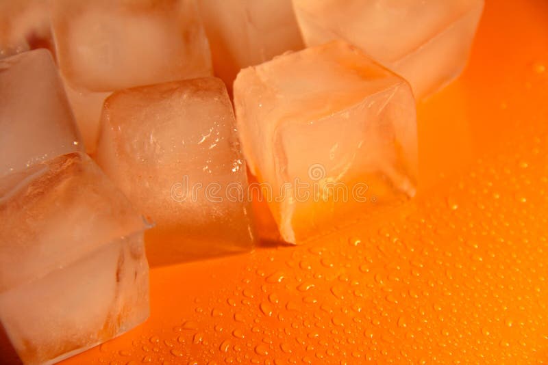 Pieces of Ice on a Bright Background with Water Drops. Orange Fresh ...