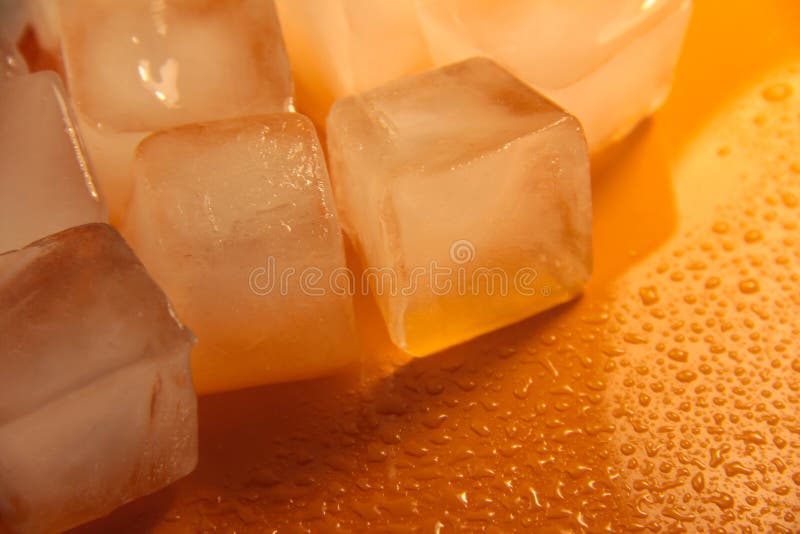 Pieces of Ice on a Bright Background with Water Drops. Orange Fresh ...