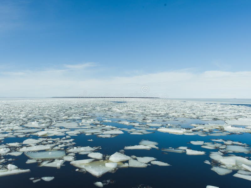 Pieces of Ice in the Frozen Lake Under the Bright Sky in Winter Stock ...
