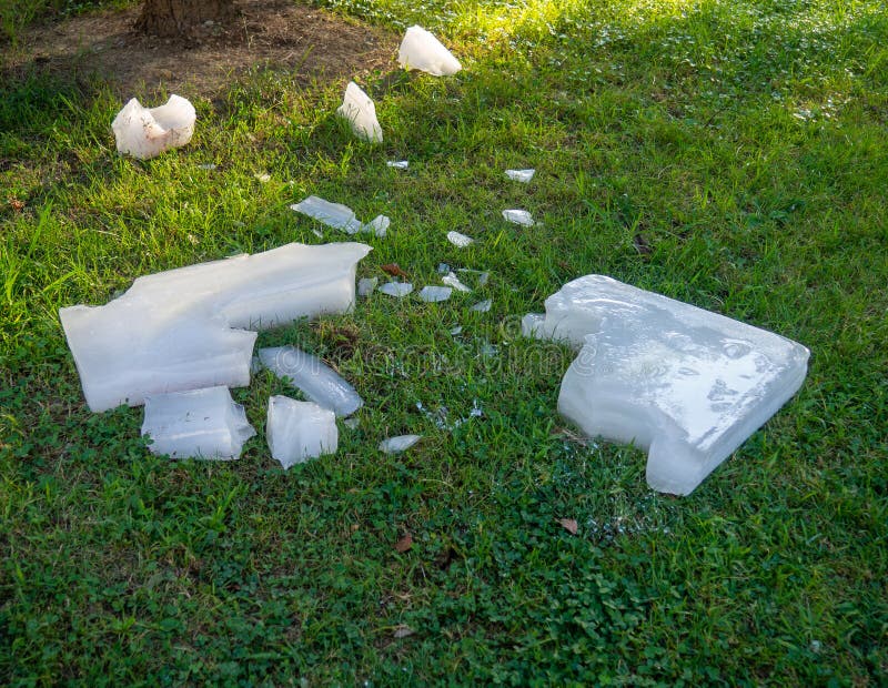 Pieces of Ice on the Grass. Discarded Ice Stock Photo - Image of frozen ...