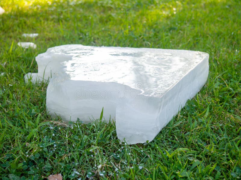 Pieces of Ice on the Grass. Discarded Ice Stock Photo - Image of ...