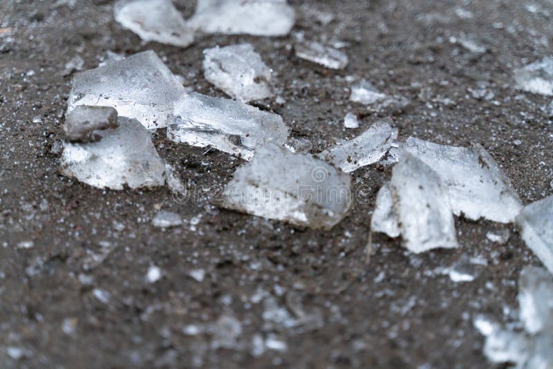 Pieces of Ice on the Grey Ground As a Background Stock Photo - Image of ...