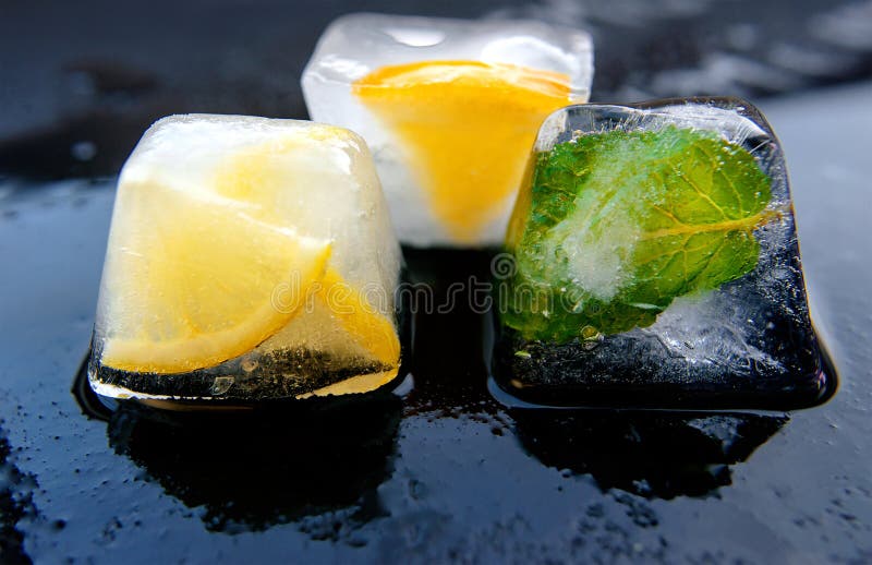 Pieces of Ice with Lemon, Mint, Orange Stock Image - Image of ...