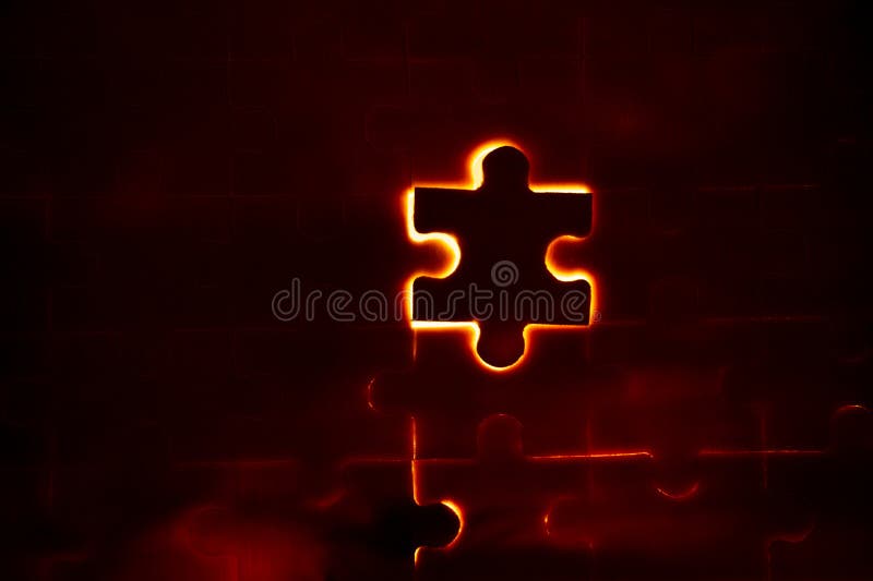 Pieces of a Jigsaw Puzzle Filled with Orange Lights by Hand Success ...